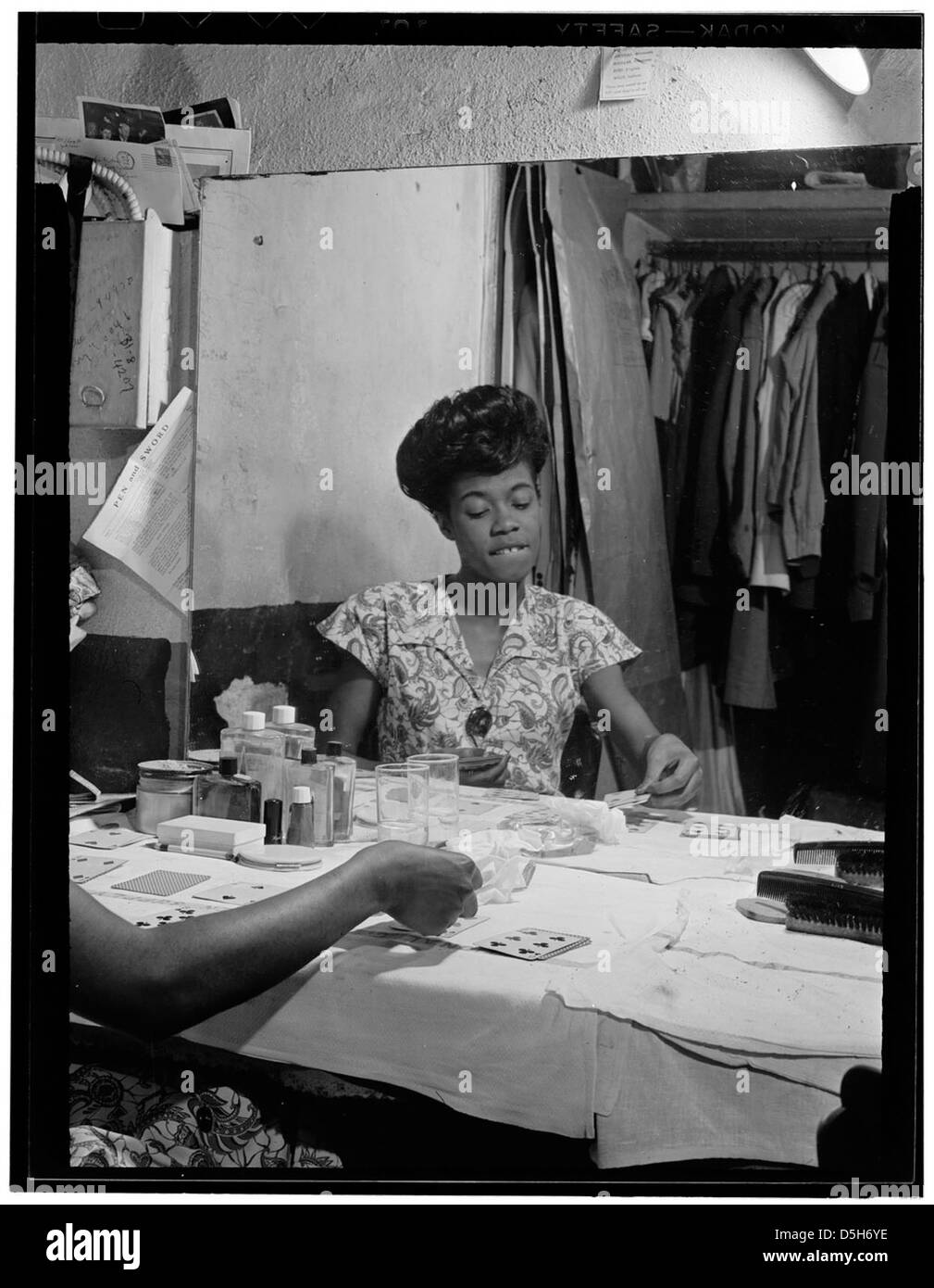 This portrait captures jazz singer Sarah Vaughan in a backstage setting ...