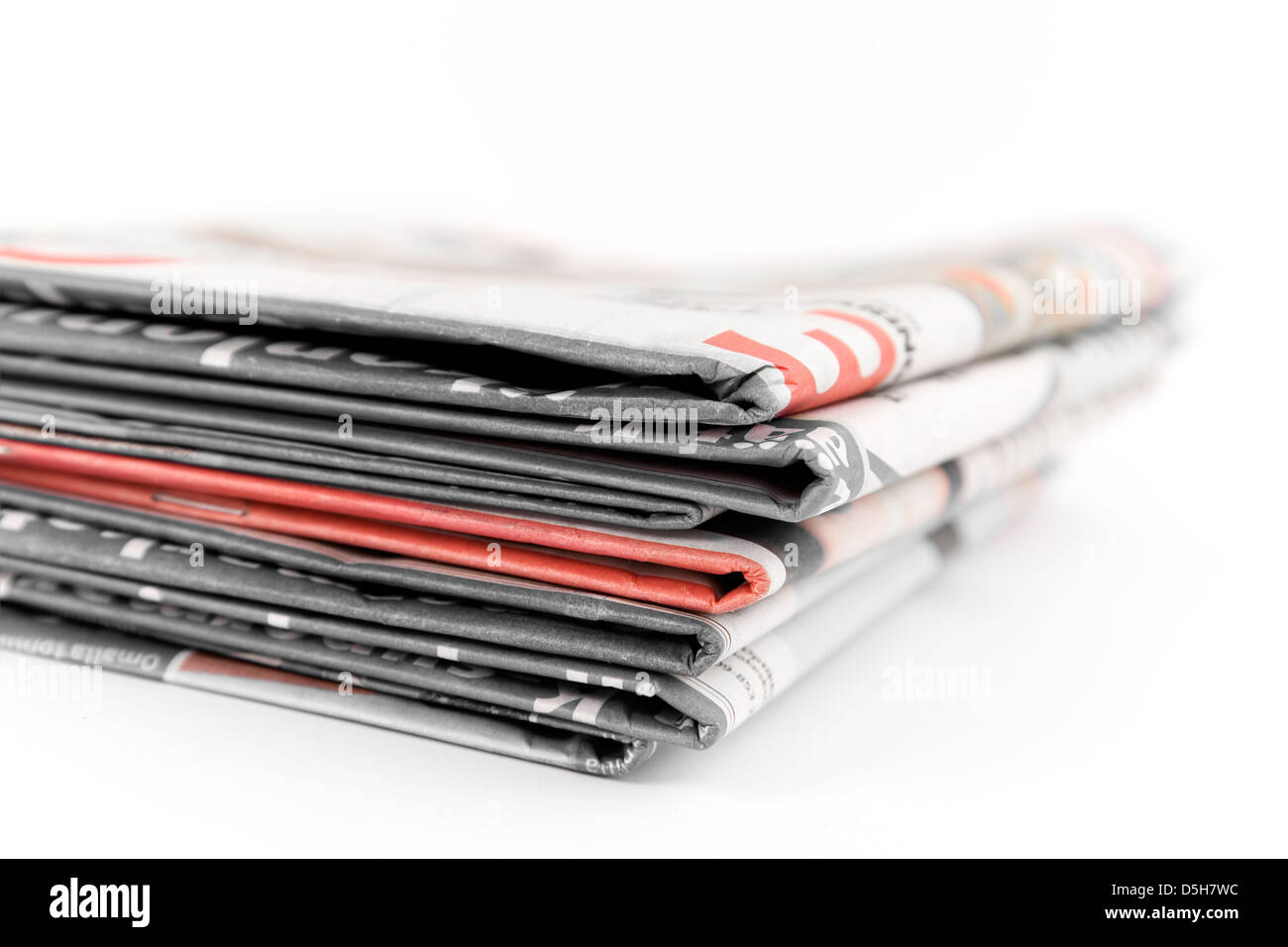 Stack of newspapers on white background Stock Photo - Alamy