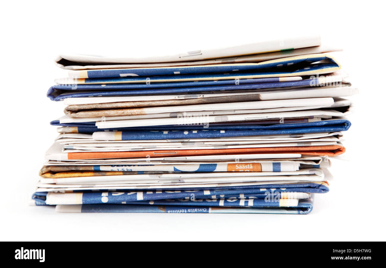 Stack of newspapers on white background Stock Photo - Alamy