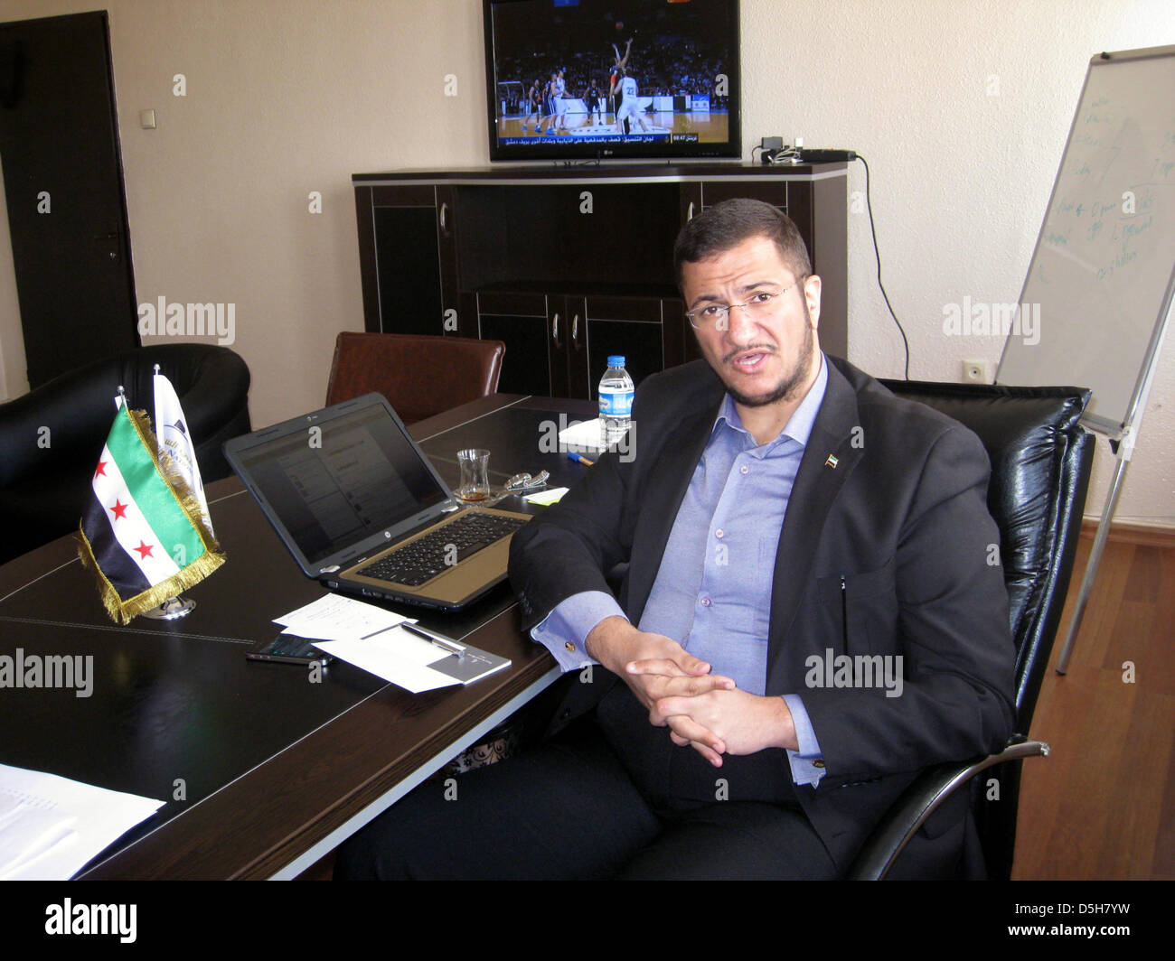 Mohammed Sarmini, head of the office of the Syrian National Council, is ...