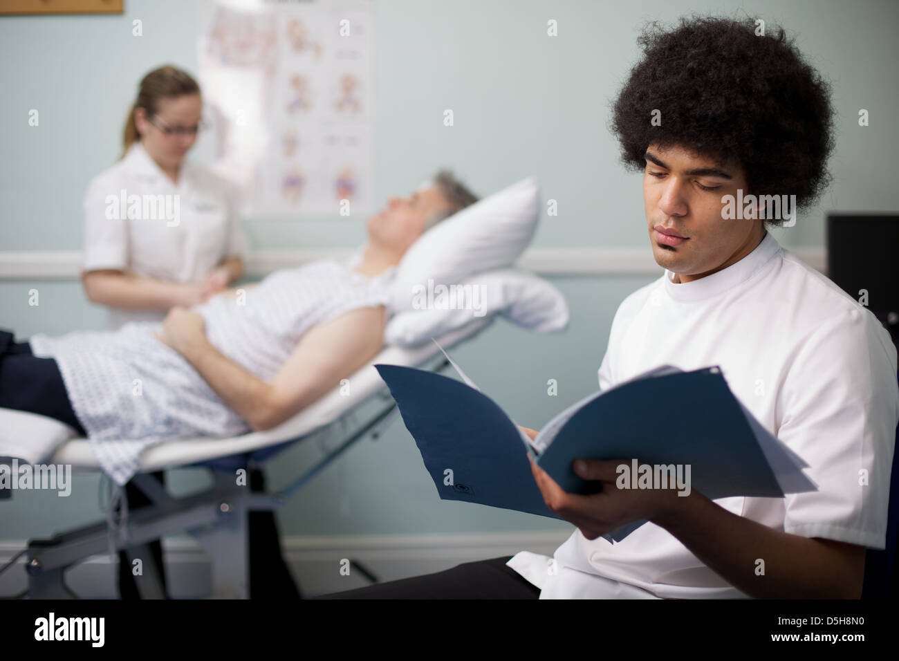 physiotherapy student studying patient notes Stock Photo - Alamy