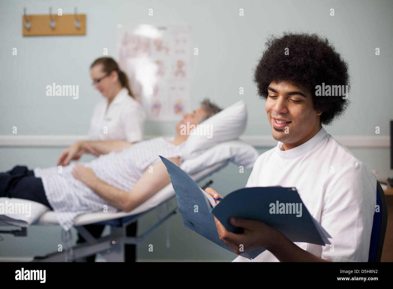 physiotherapy student studying patient notes Stock Photo - Alamy