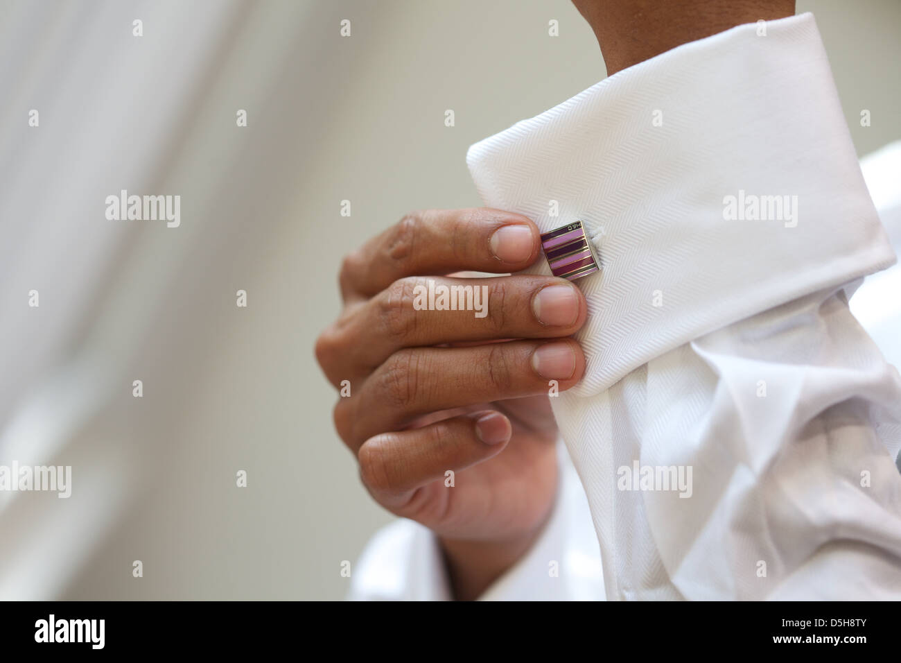 Close up shot of man adjusting his cuff link hi-res stock photography ...