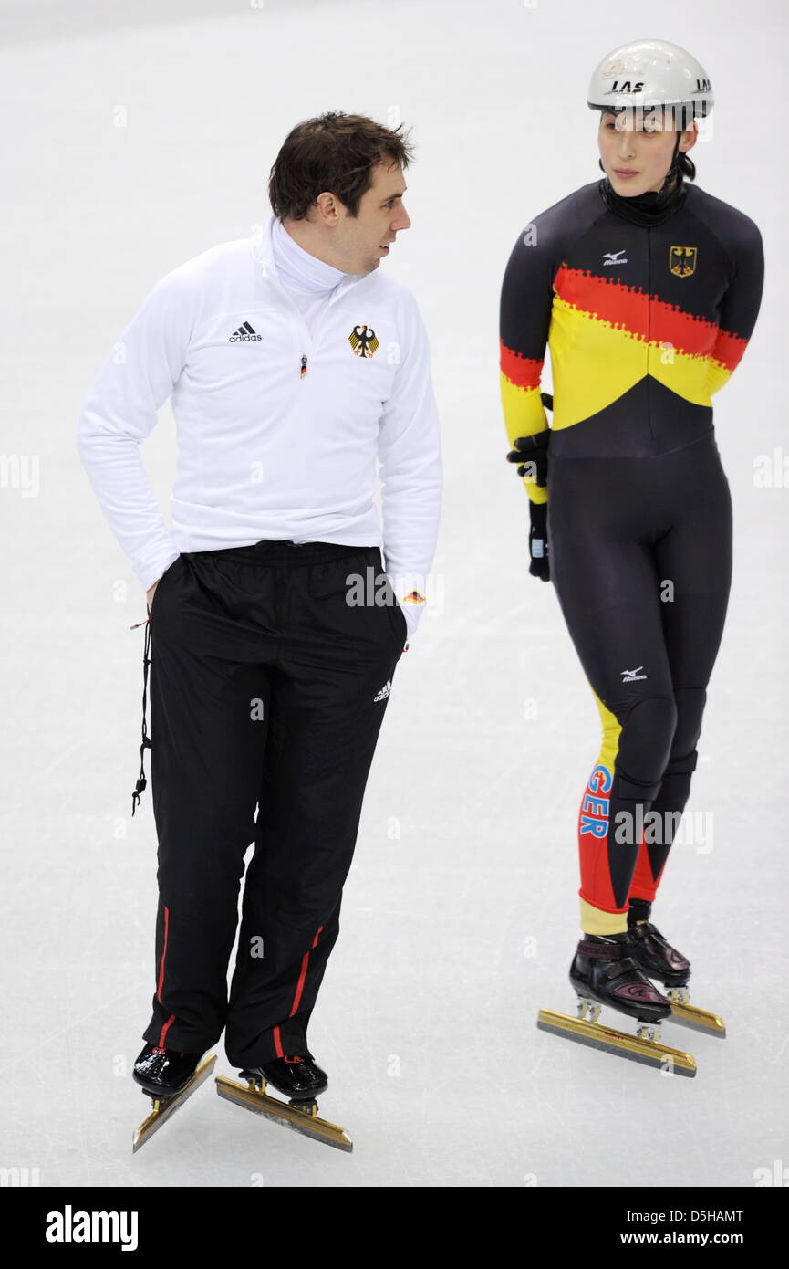German short tracker Aika Klein (R) talks to German coach Eric Bedard ...