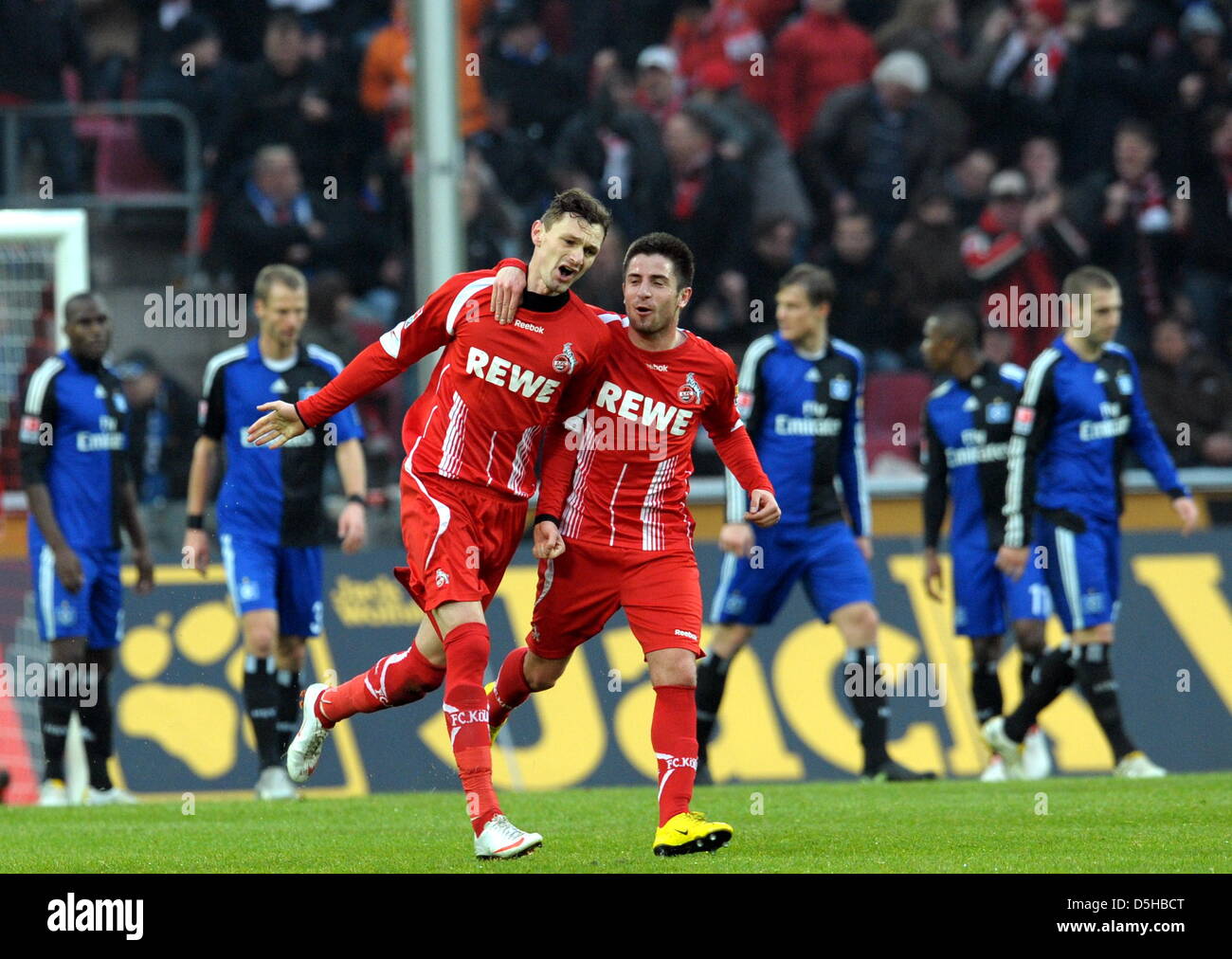 Cologne's Milivoje Novakovic (L) celebrates his 2-3 score with teammate ...