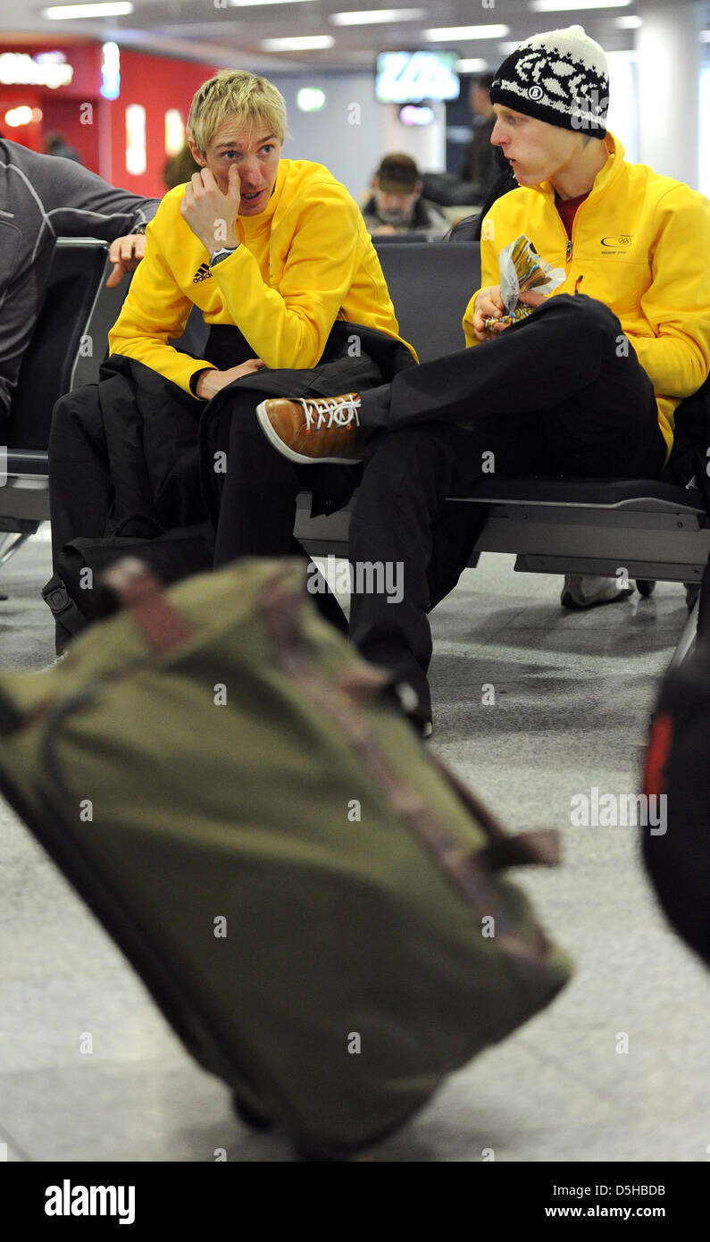 German ski jumpers Michael Uhrmann (L) and Pascal Bodmer talk prior to ...