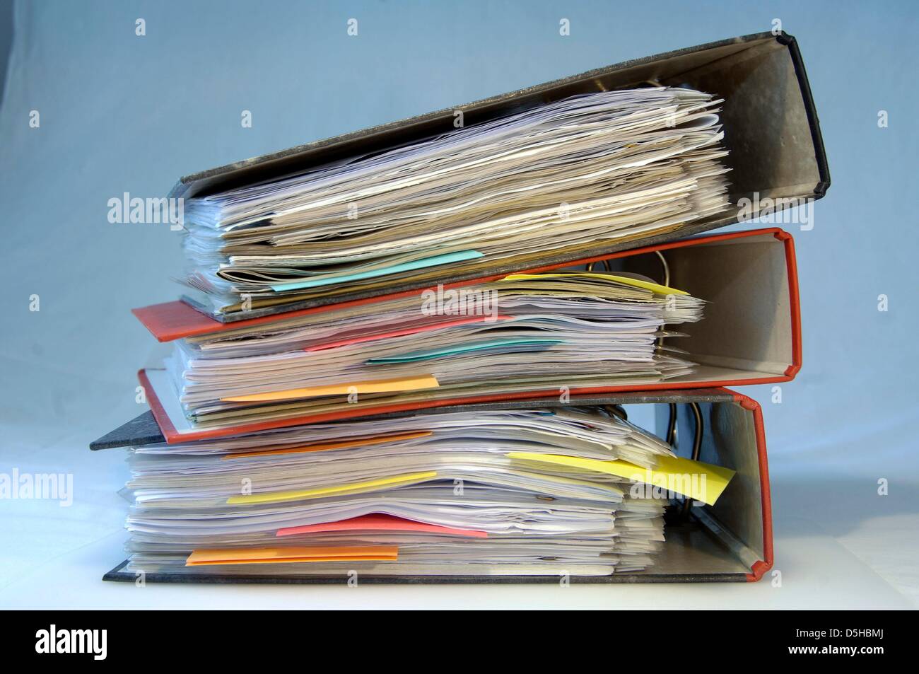 ILLUSTRATION - Filing folders stacked on top of one another, a placed ...
