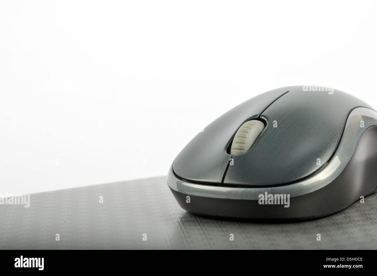Wireless computer mouse on a metallic background Stock Photo - Alamy