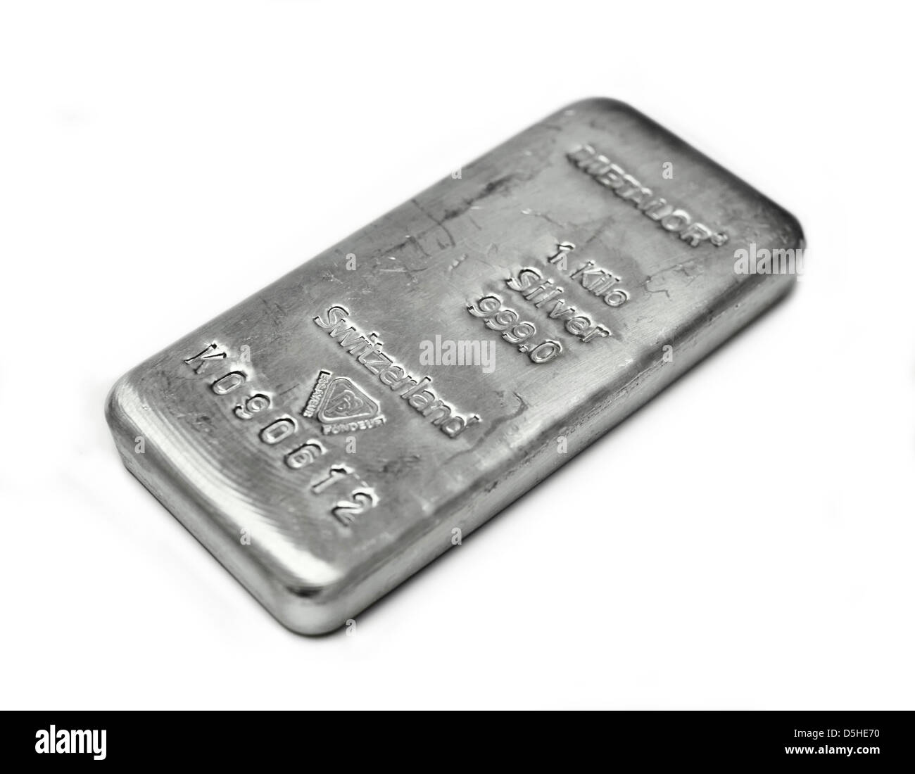 Silver bullion bar weighing one kilogram on plain white background ...