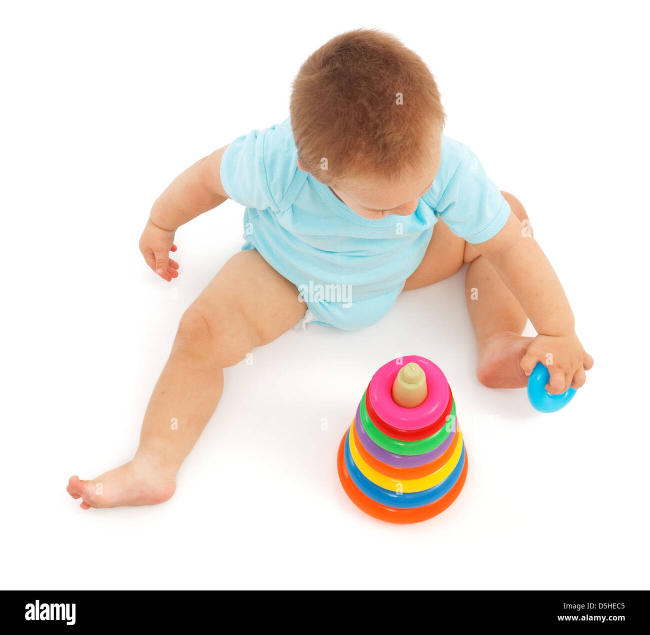 Little baby boy playing with colorful ring toy Stock Photo - Alamy