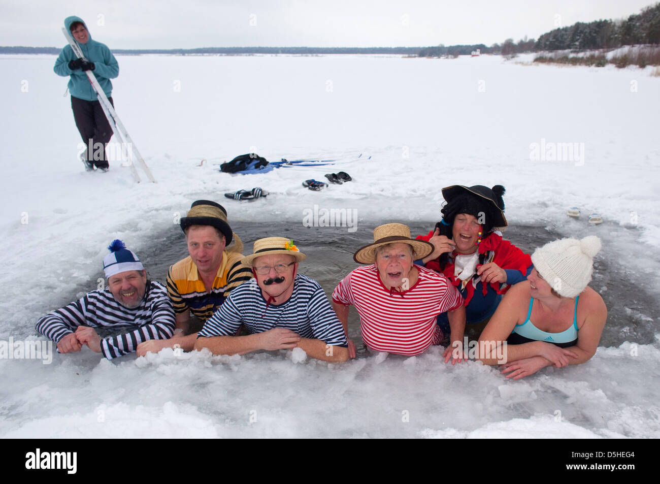 Members of the ice bathing group ''Helene-Lions'' bath in an ice hole ...