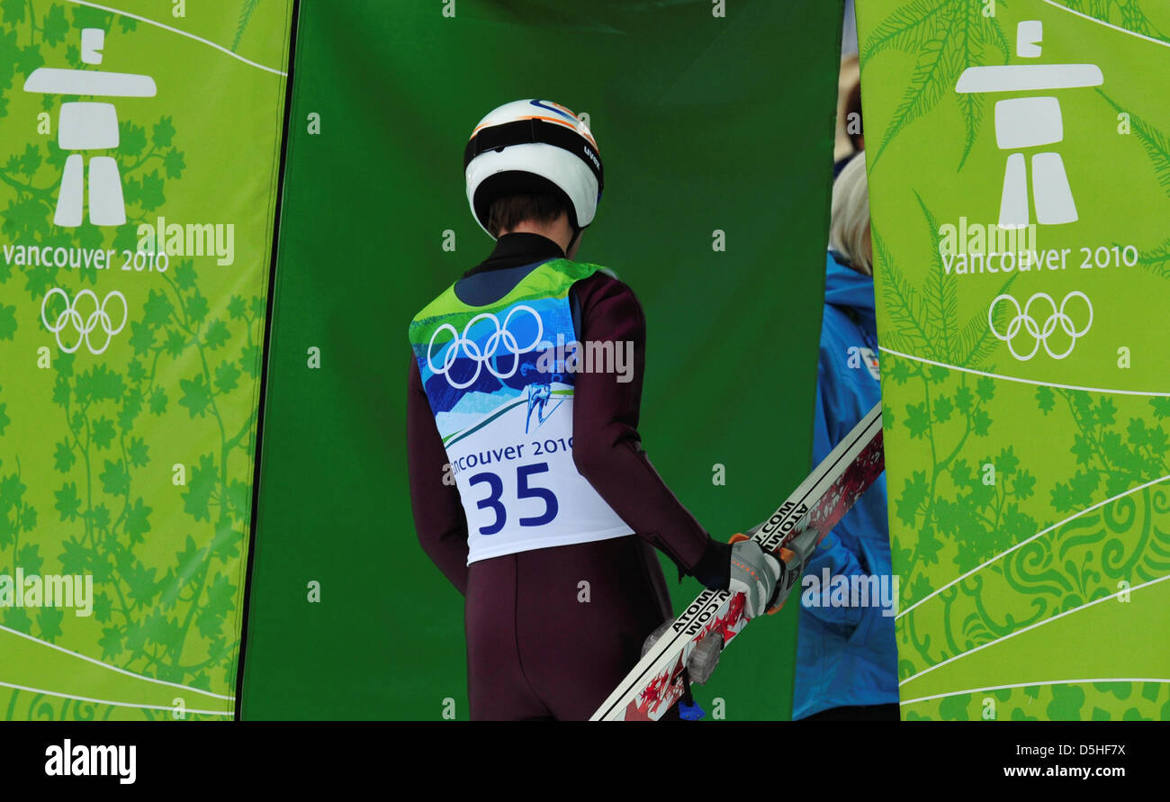 Michael Neumayer of Germany reacts after his first jump of the Ski ...