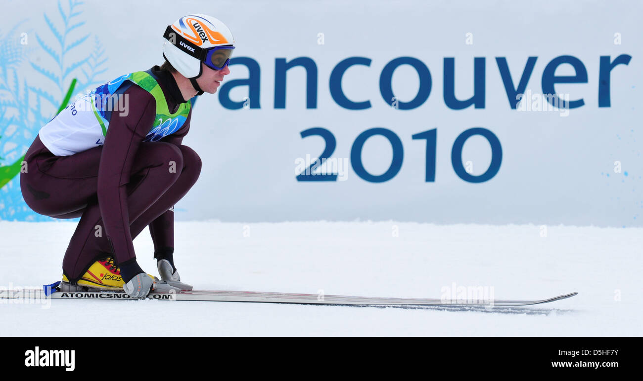 Michael Neumayer of Germany reacts after his first jump of the Ski ...