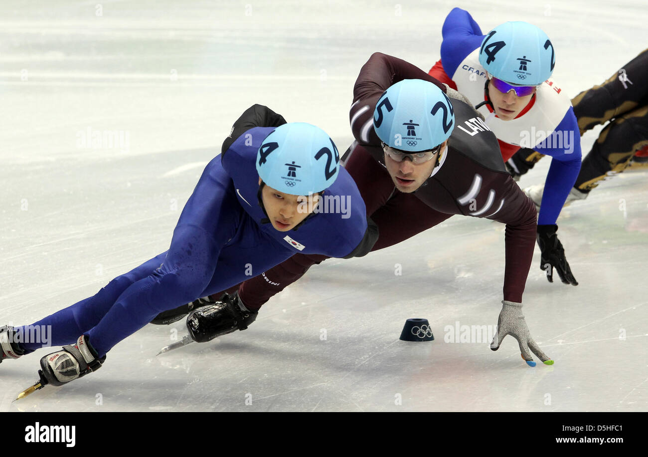 Short Track Speed Skater Haralds Silvos (C) of Latvia in action the ...