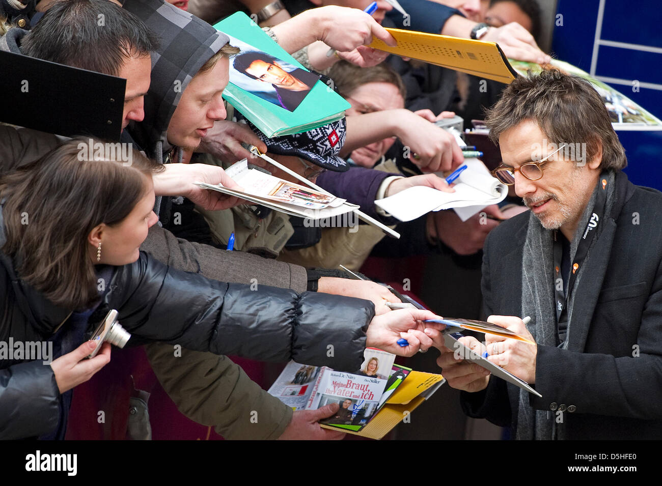 US actor Ben Stiller sings autographs as he arrives for the photocall ...