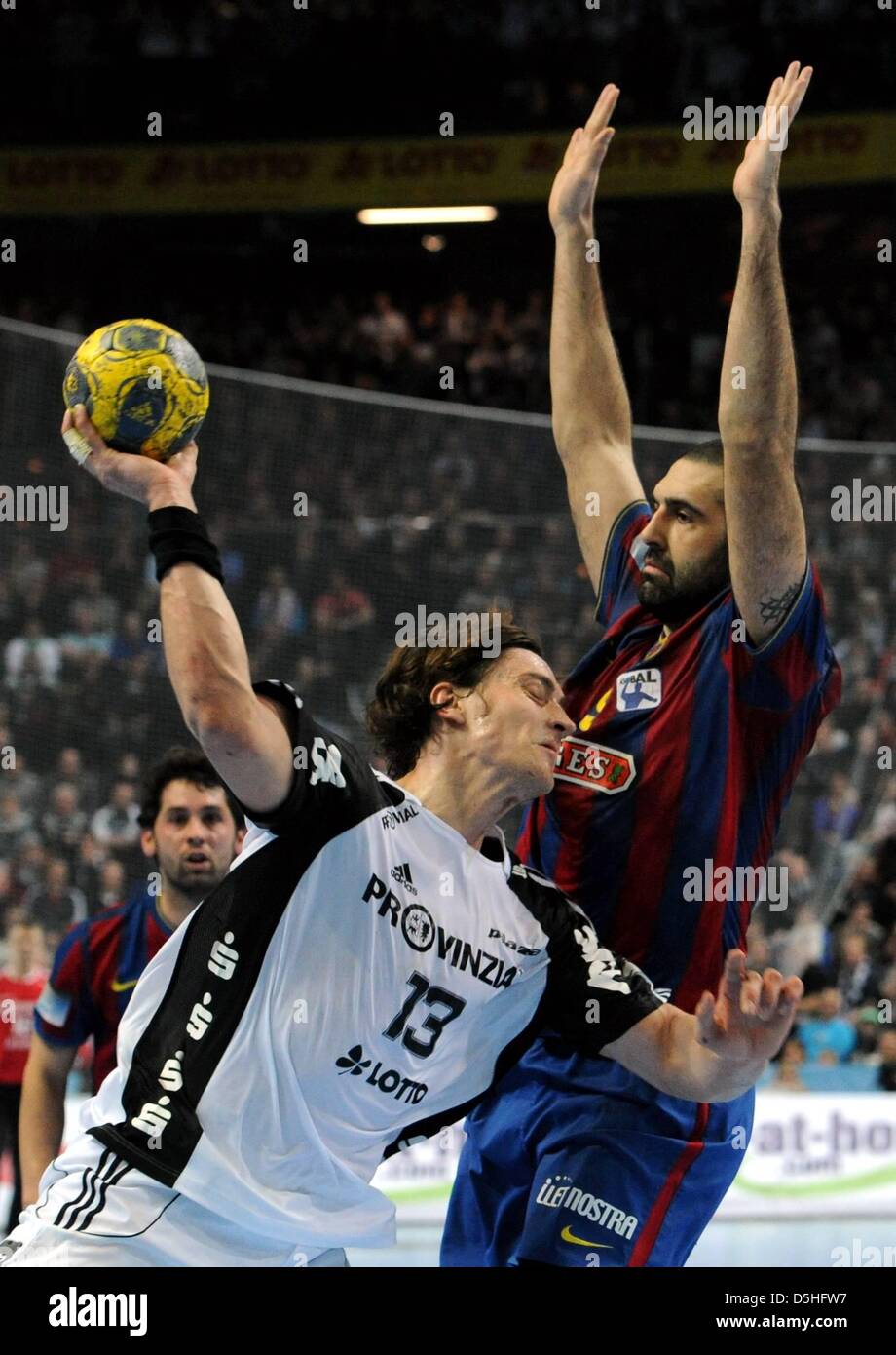 Kiel's Marcus Ahlm (L) and Ruben Garabaya of Barcelona in action during ...
