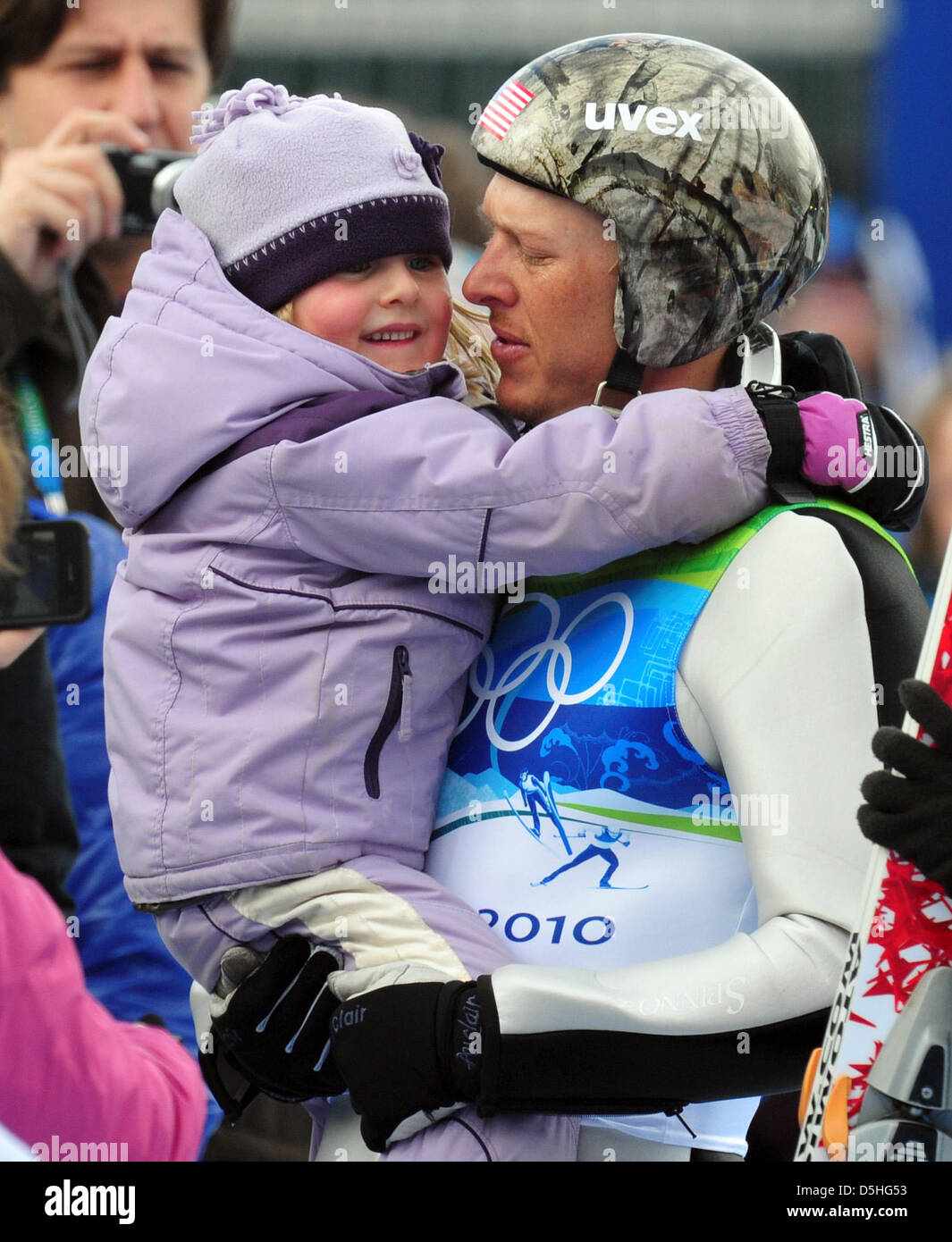 Todd Lodwick embraces his daughter Charley after his first jump in the ...