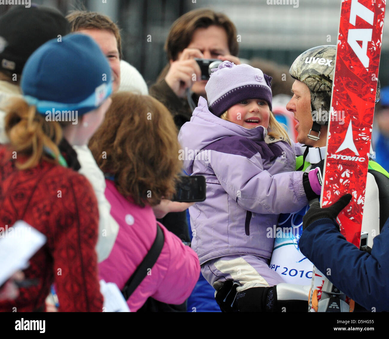 Todd Lodwick embraces his daughter Charley after his first jump in the ...