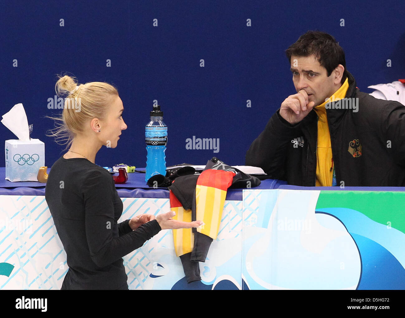 Pair skater Aliona Savchenko of Germany talks to coach Ingo Steuer (R ...