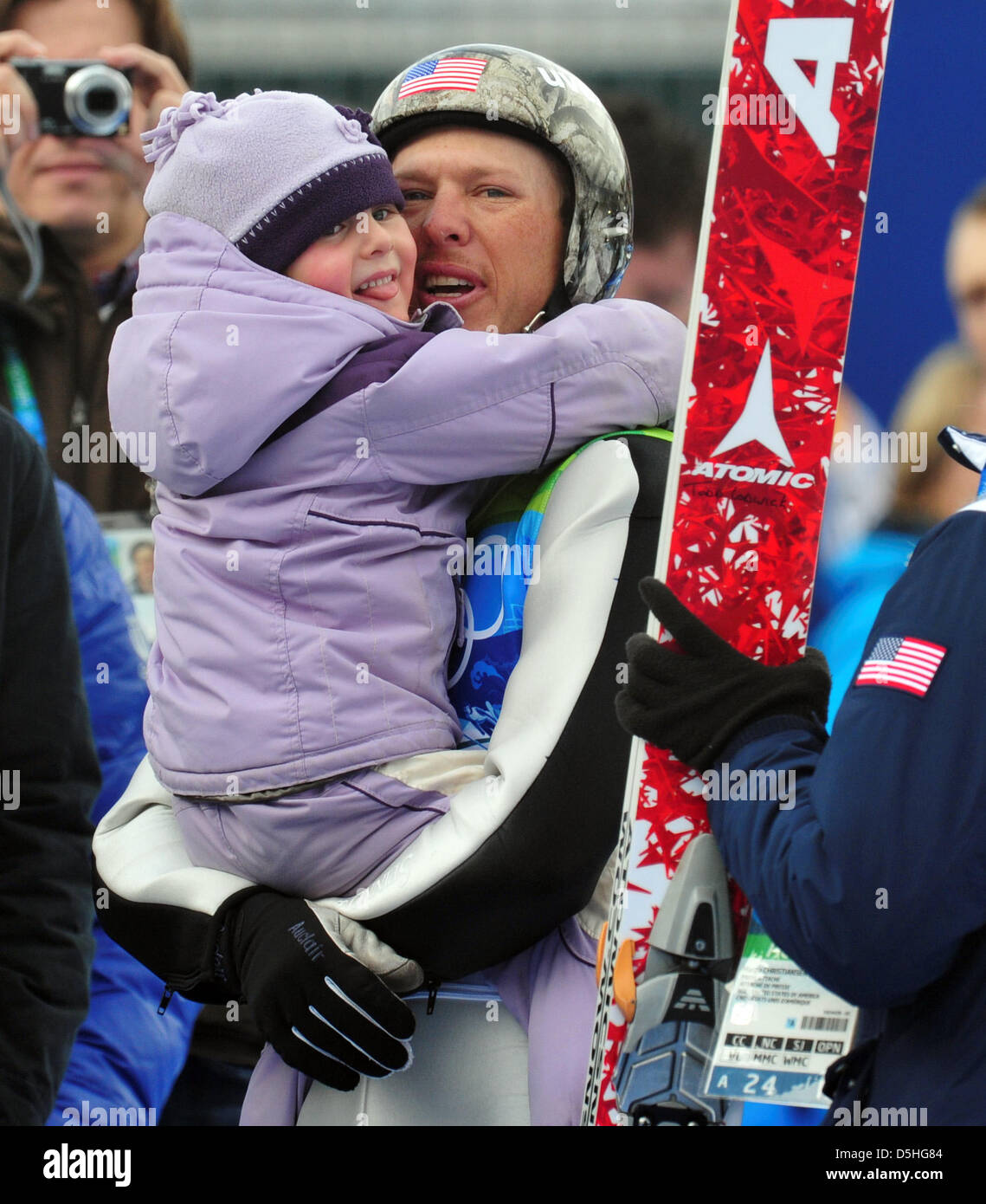 Todd Lodwick embraces his daughter Charley after his first jump in the ...
