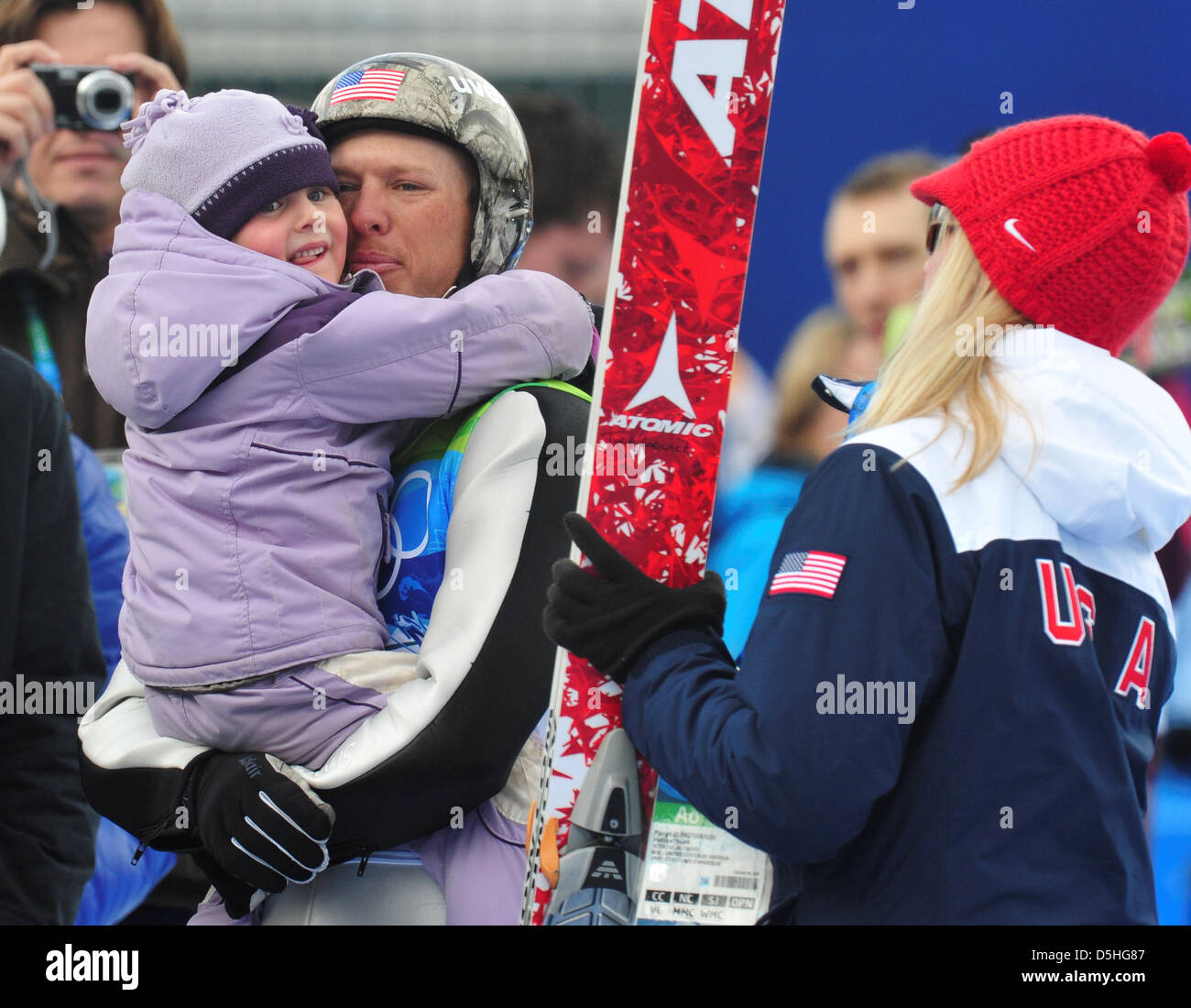 Todd Lodwick embraces his daughter Charley after his first jump in the ...