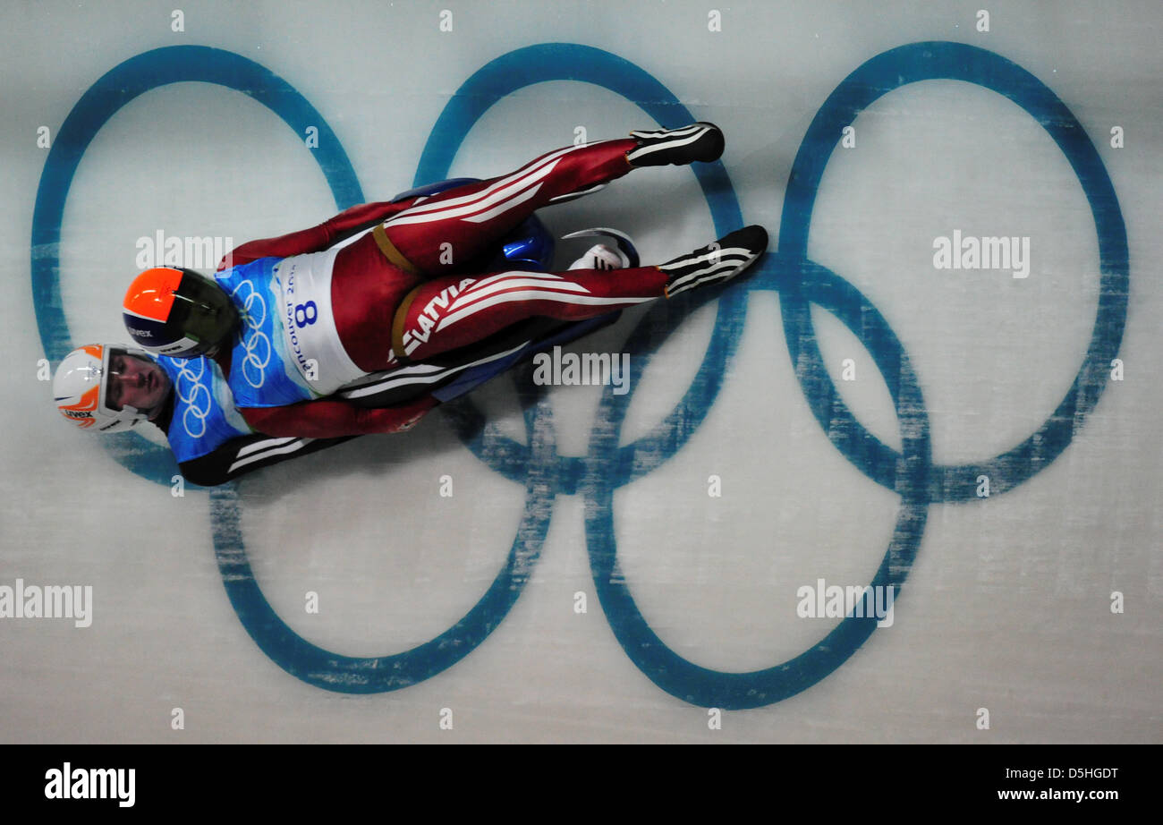 Oskars Gudramovics (r) and Peteris Kalnins of Latvia take a curve ...