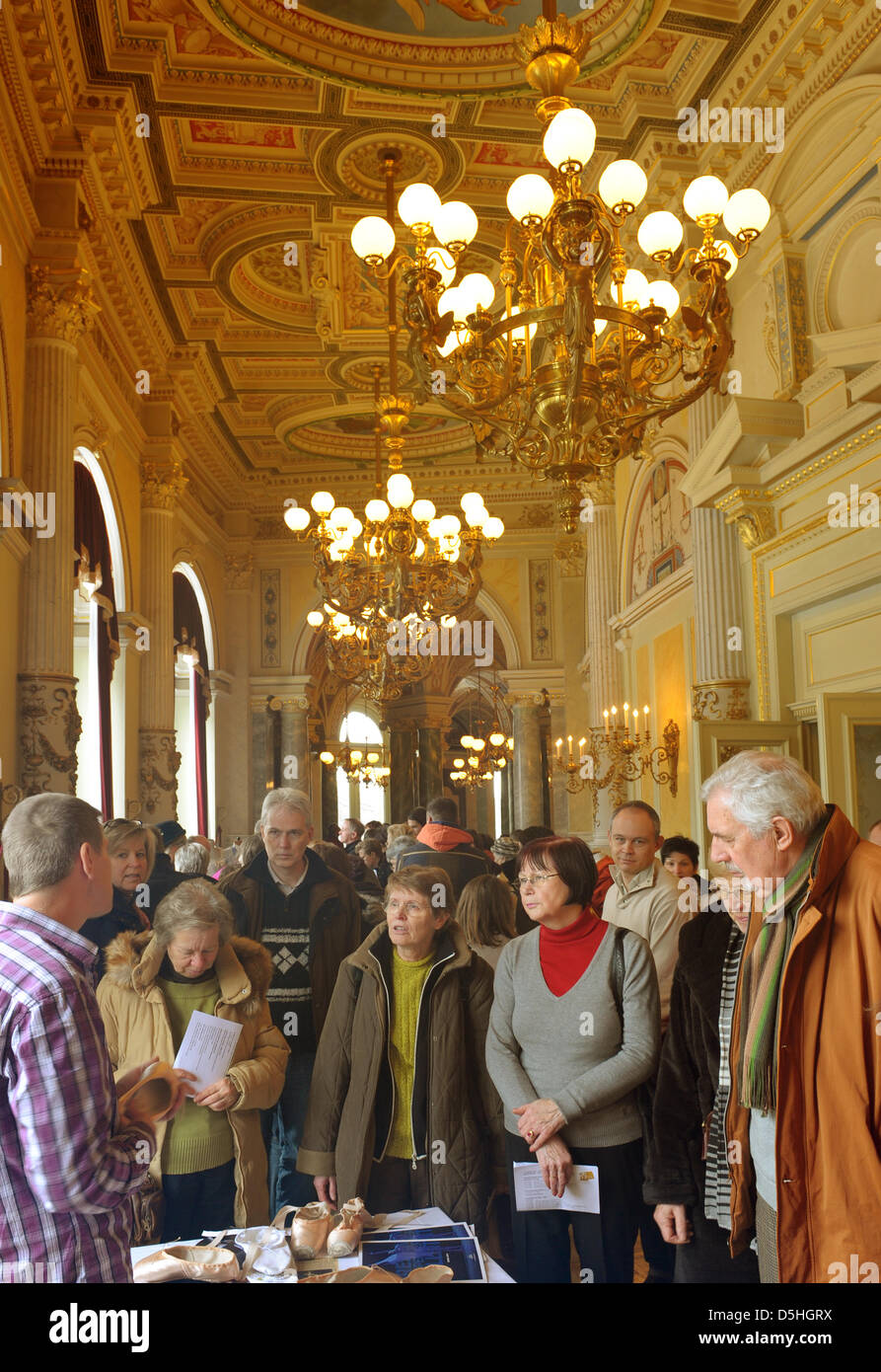 Visitors view festive concert hall of Dresden's Semper Opera brightly ...