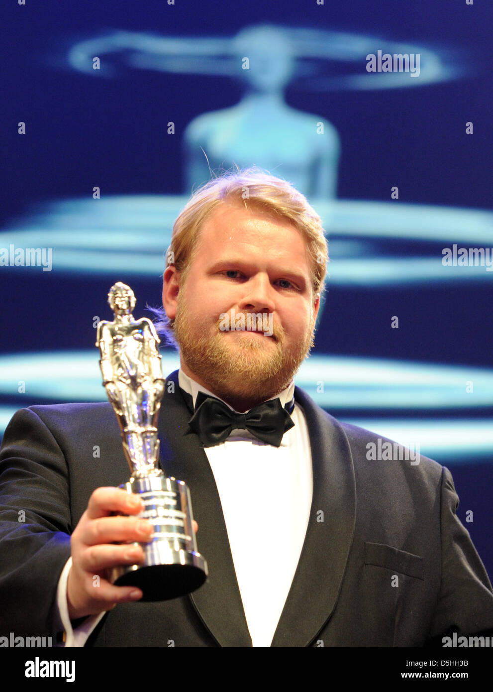 Norwegian actor Anders Baasmo Christiansen holds his Shooting Star ...