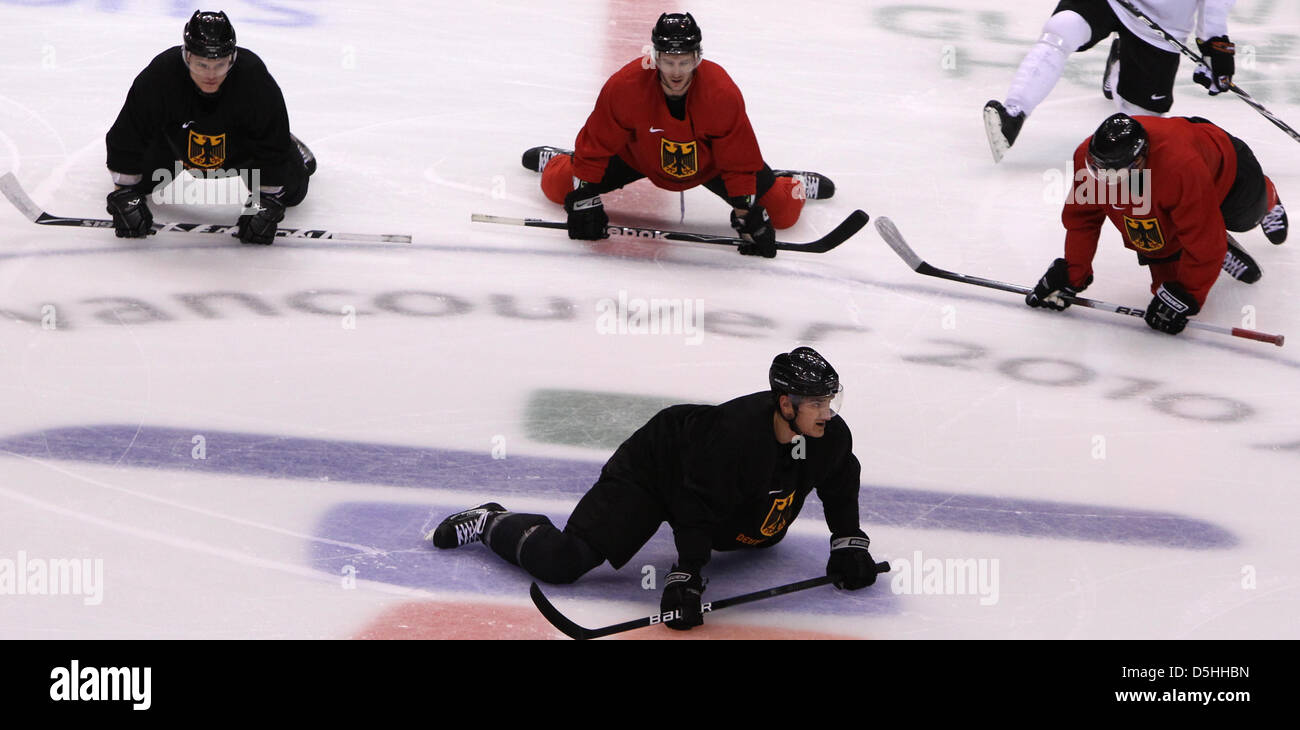 German Ice Hockey players Michael Bakos (front), Marcel Goc (L) and ...