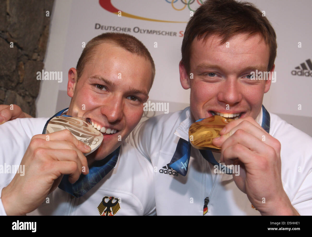 Gold medalistFelix Loch (R) of Germany and compatriot David Moeller ...