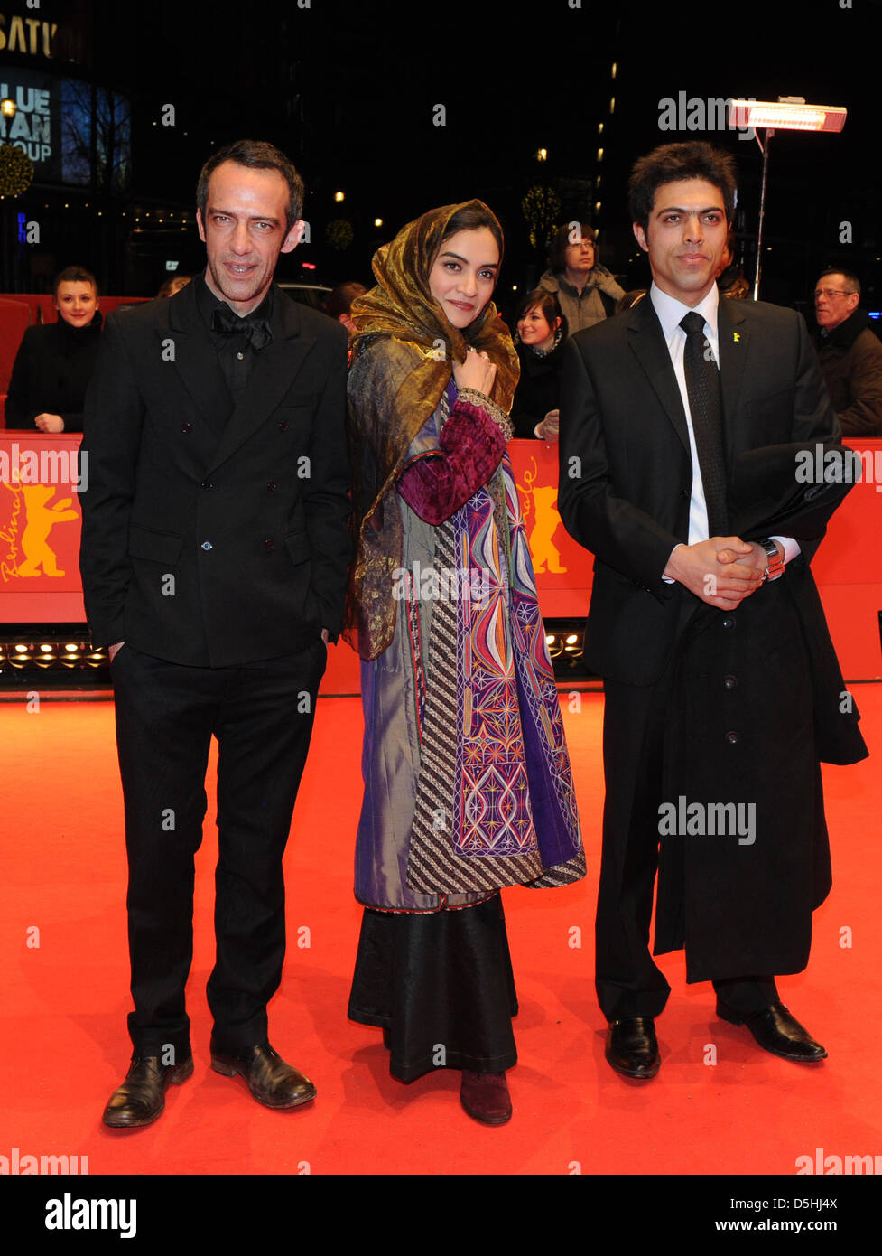 Iranian director Rafi Pitts (L), Iranian actress Mitra Hajjar and Hassan Ghal'e Noui arrive for ...
