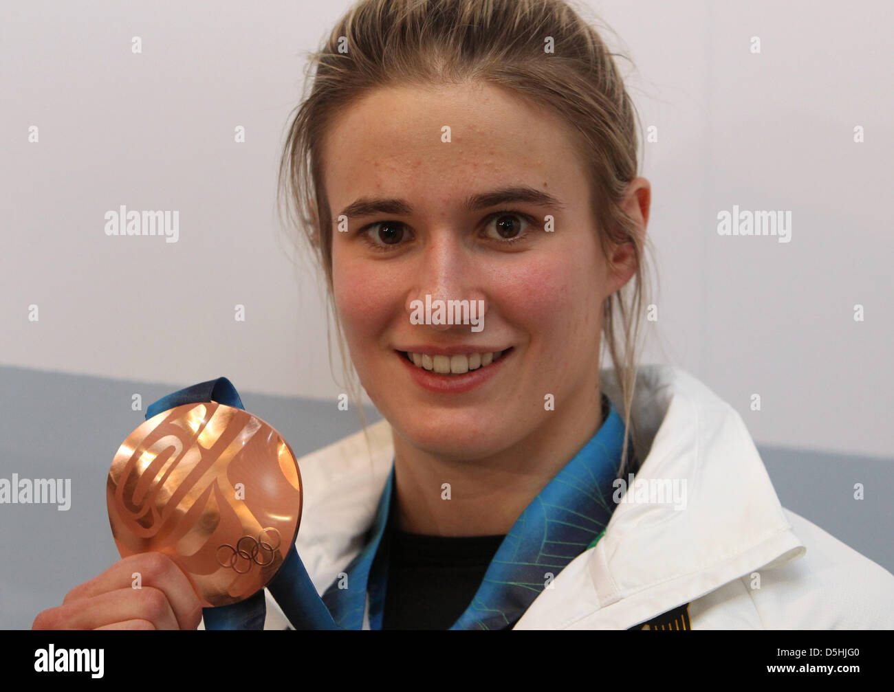 Natalie Geisenberger of Germany shows her Bronze medal of the Luge ...