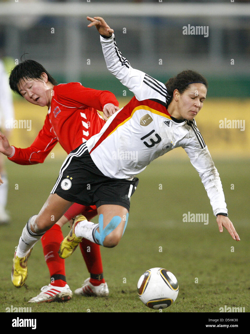 Germany's Celia Okoyino da Mbabi (R) and North Korea's Yu Jong Hu vie ...