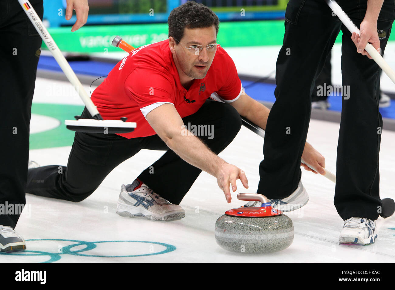 Skip Andy Kapp of Germany releases the stone during Curling men's round ...
