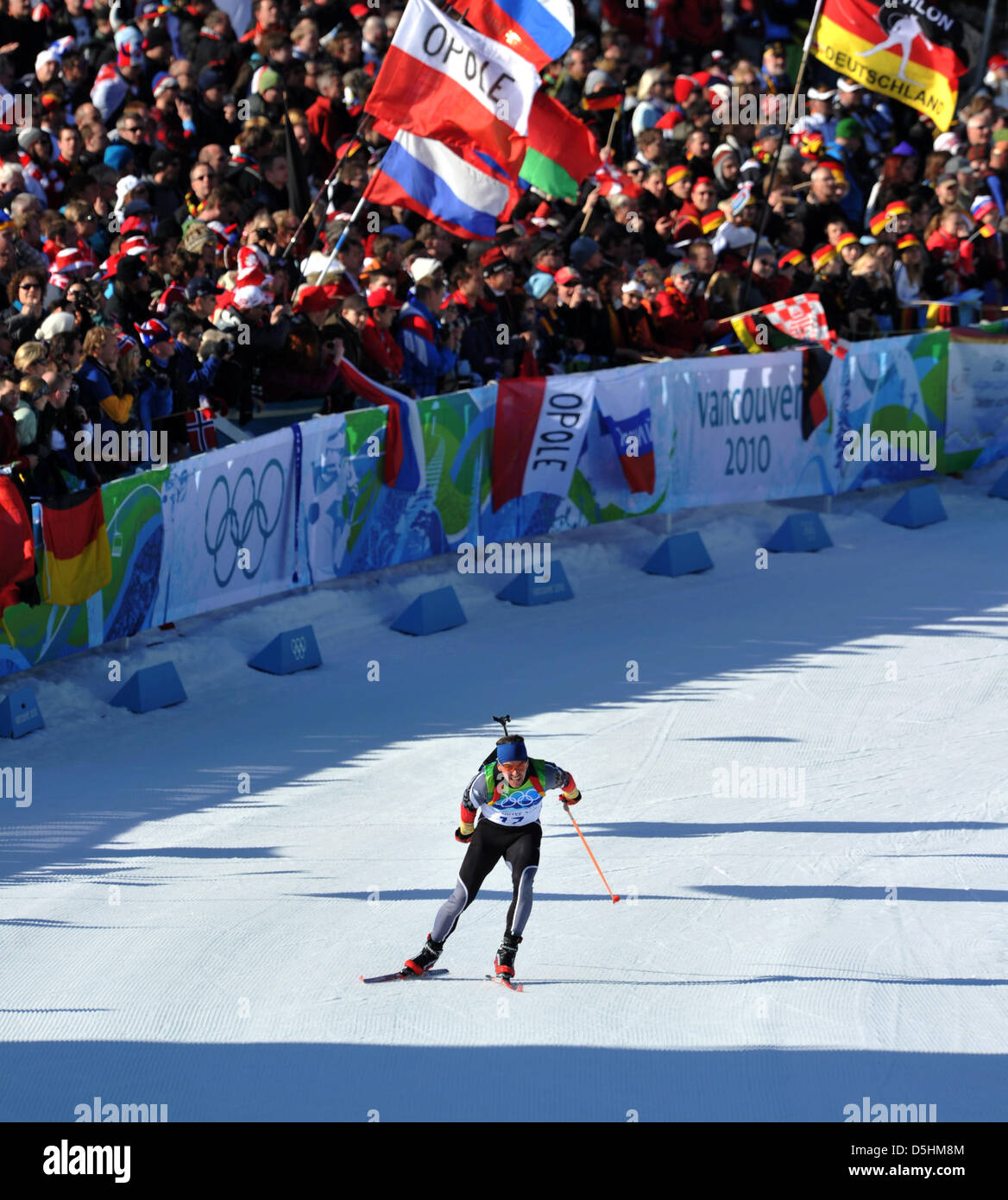 Michael Greis of Germany finishes in the Menøs biathlon 20km individual ...