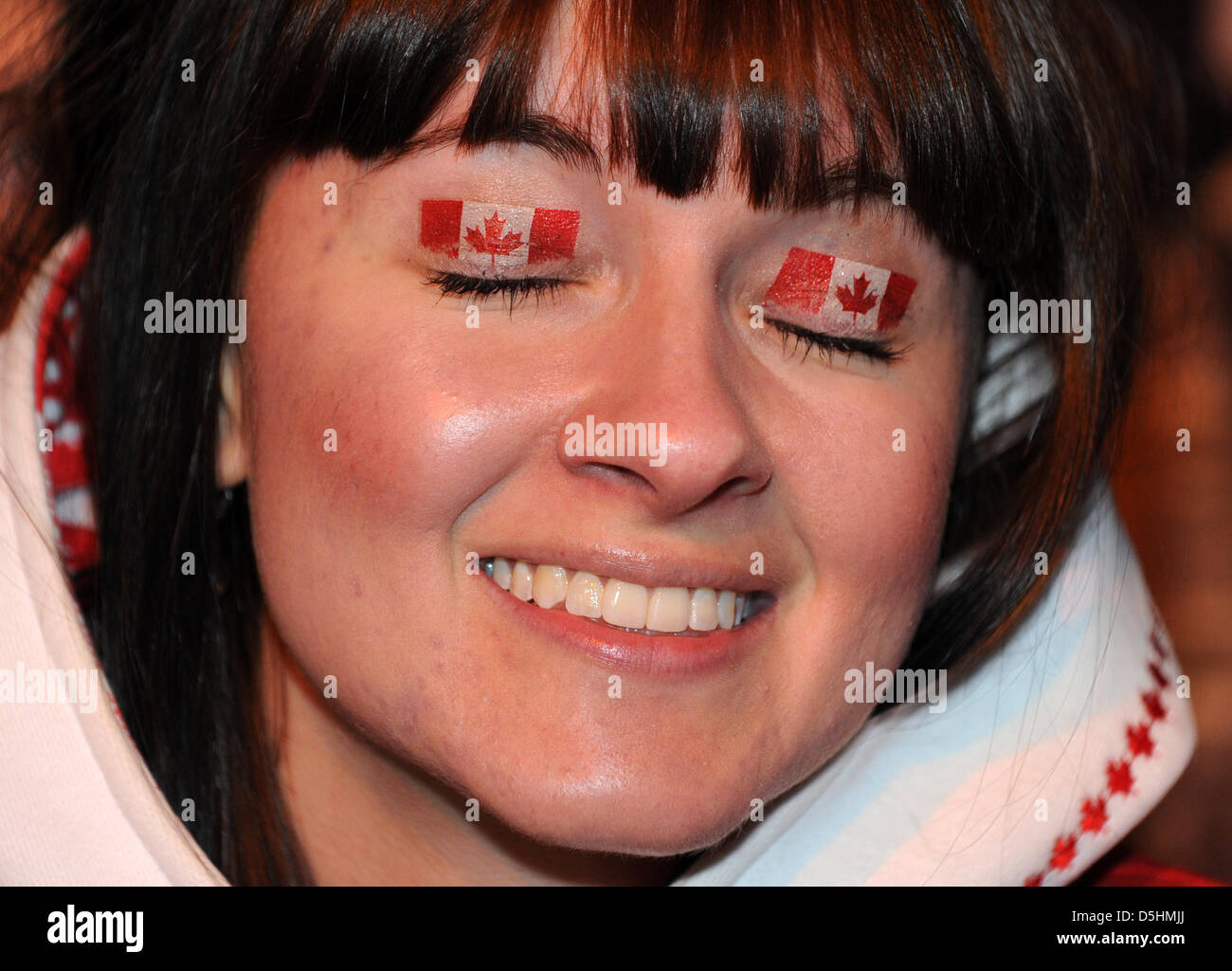 Spectator Andrea from Calgary in Canada shows the Maple leaf painted on ...