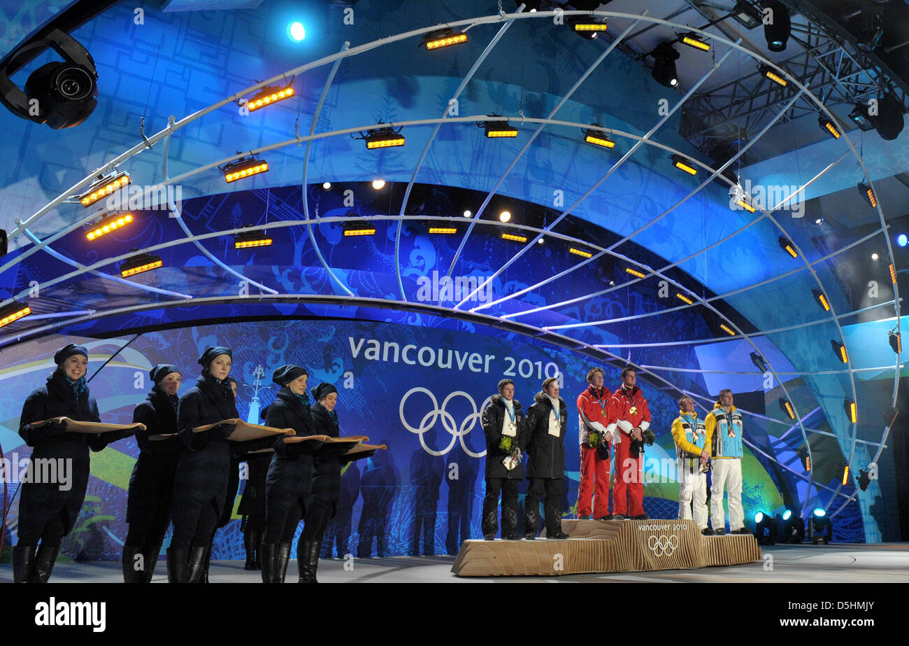 Medalist pose on the podium during the medal ceremony at the Luge ...