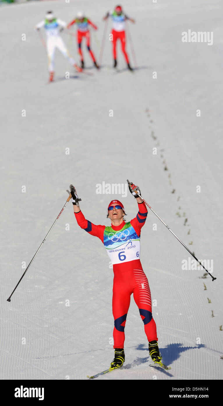 Gold medalist Marit Bjoergen (front) of Norway celebrates after she ...