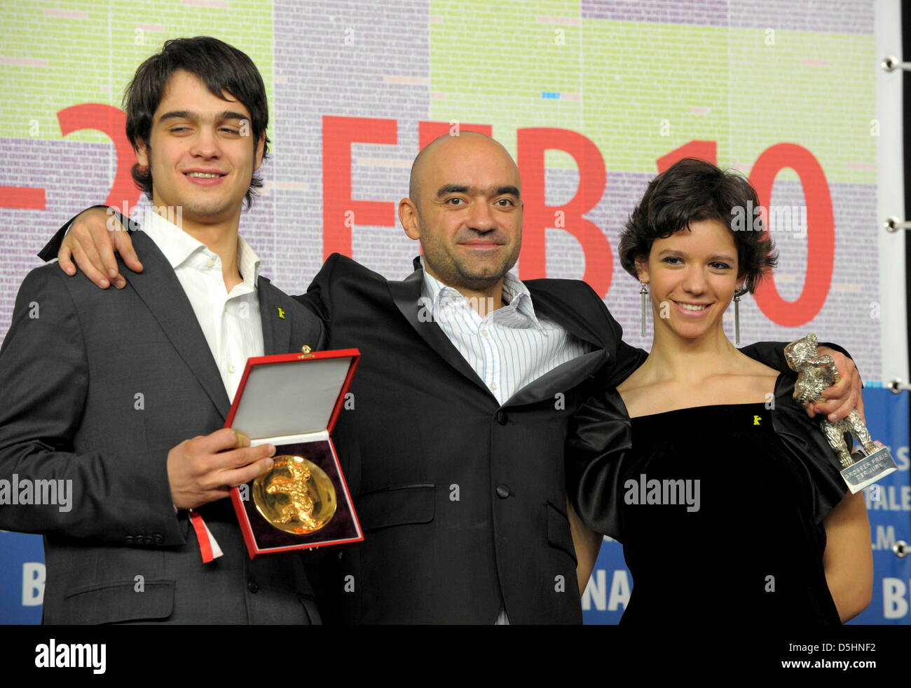 Director Florin Serban (C) holds the Silver Bear - The Jury Grand Prix ...