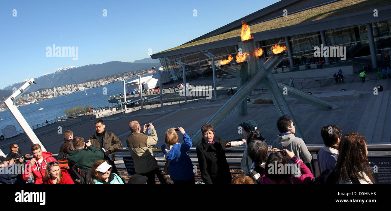 People take photos from an access ramp opened to the public to allow an ...