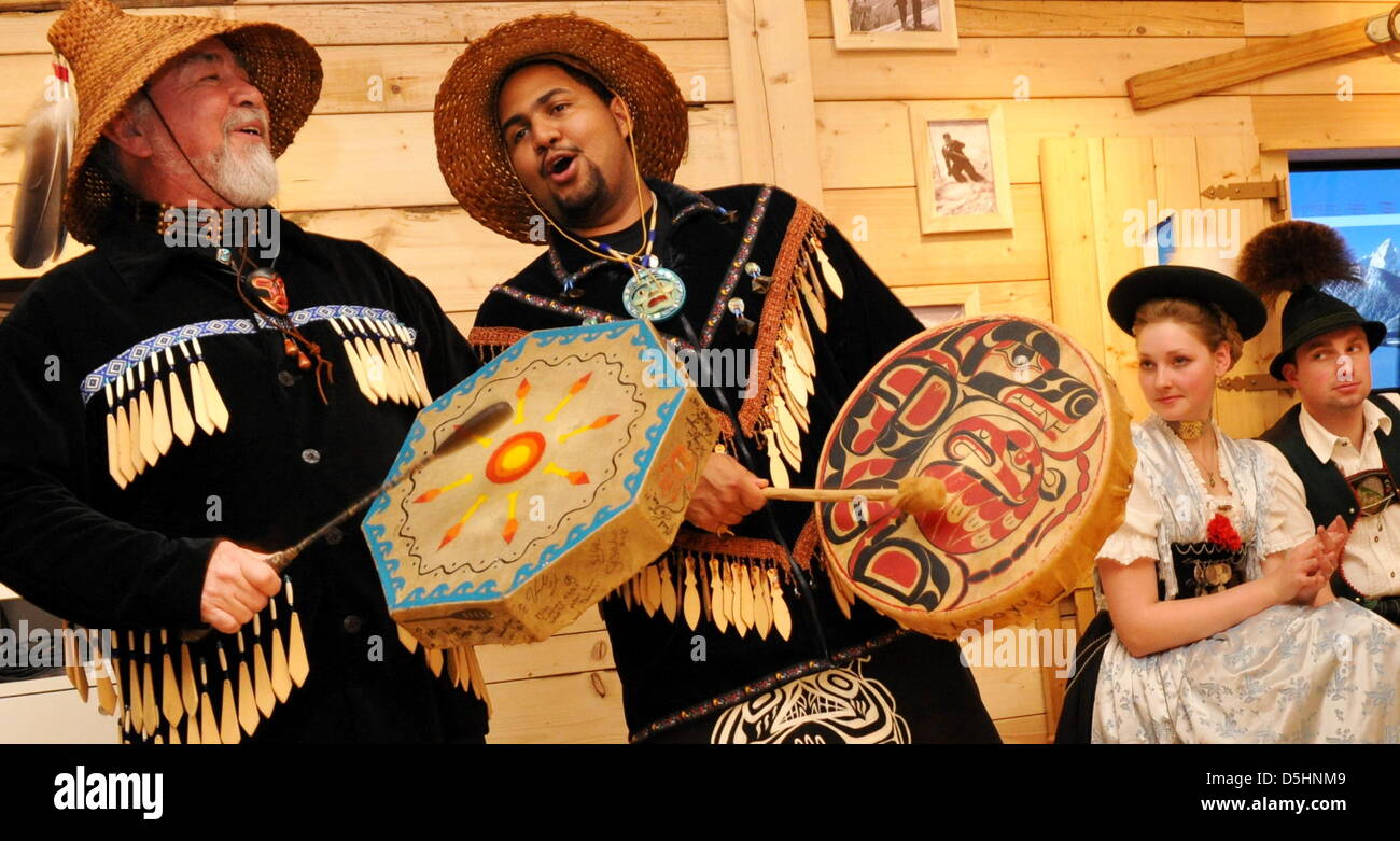 A Canadian First Nations Dance Group performs watched by Bavarian folk ...