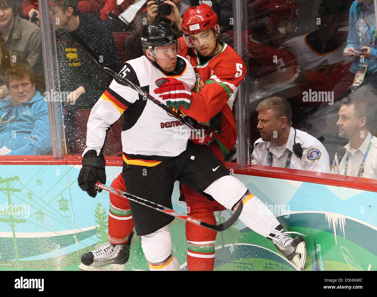 Marcel Mueller (L) of Germany fights for the puck with Nikolai Stasenko of Belarus during Ice ...