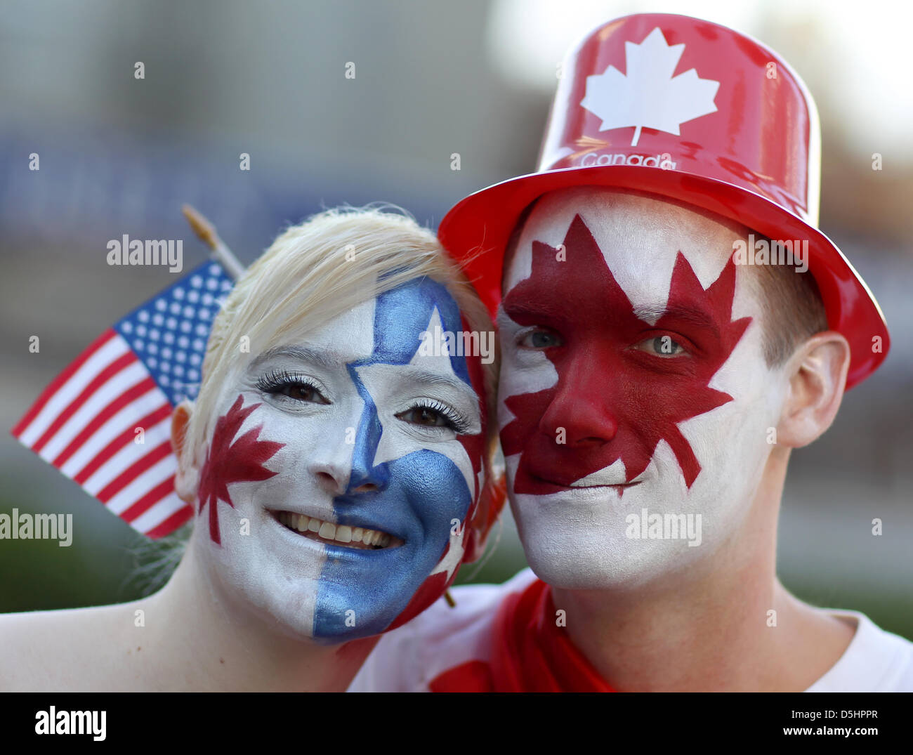 A Canadian (R) fan and a fan of USA are seen in the streets of downtown ...