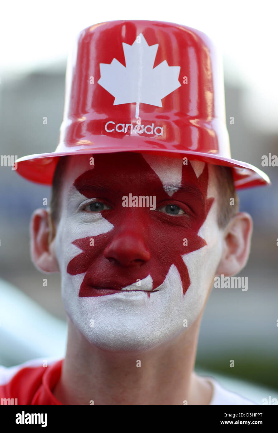 A Canadian fan is seen in the streets of downtown Vancouver, during the ...