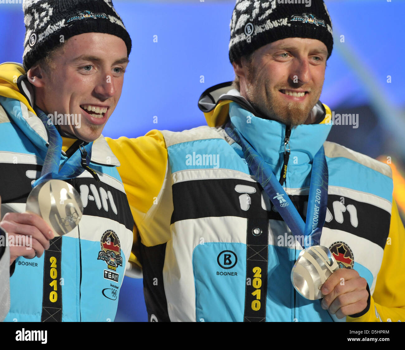 Silver medallists Tim Tscharnke (L) and Axel Teichmann of Germany ...