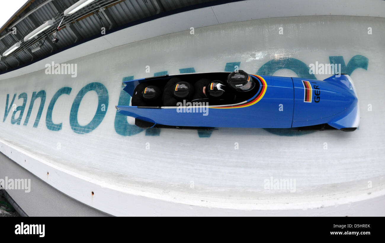 Andre Lange of Germany 1 takes a curve during the Bobsleigh Four-Man ...