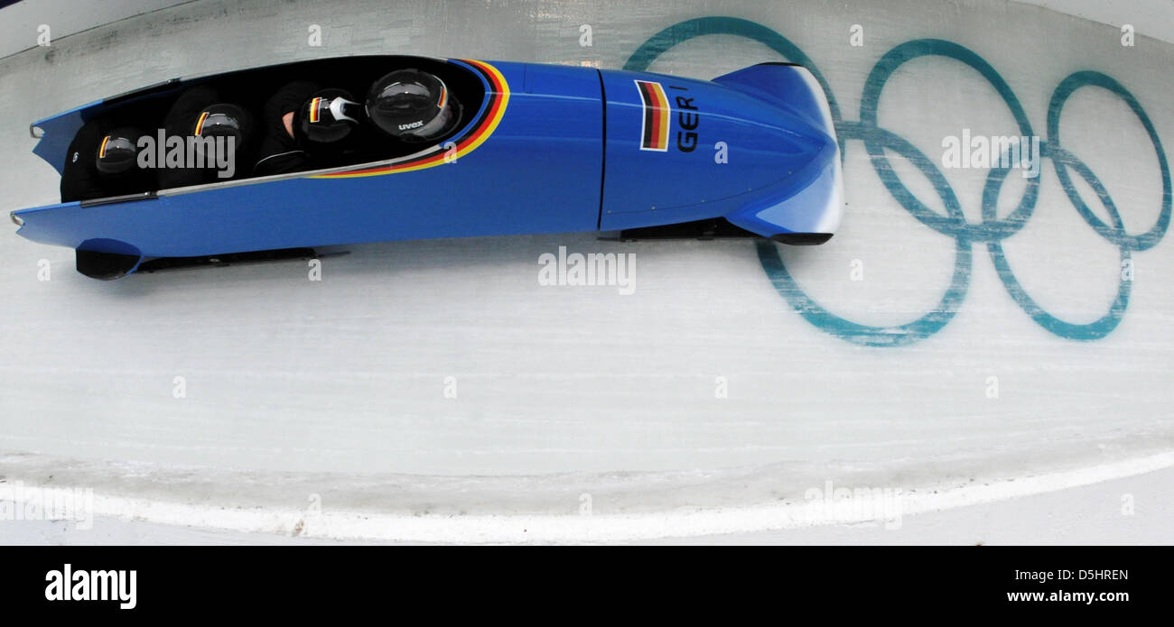 Andre Lange of Germany 1 takes a curve during the Bobsleigh Four-Man ...