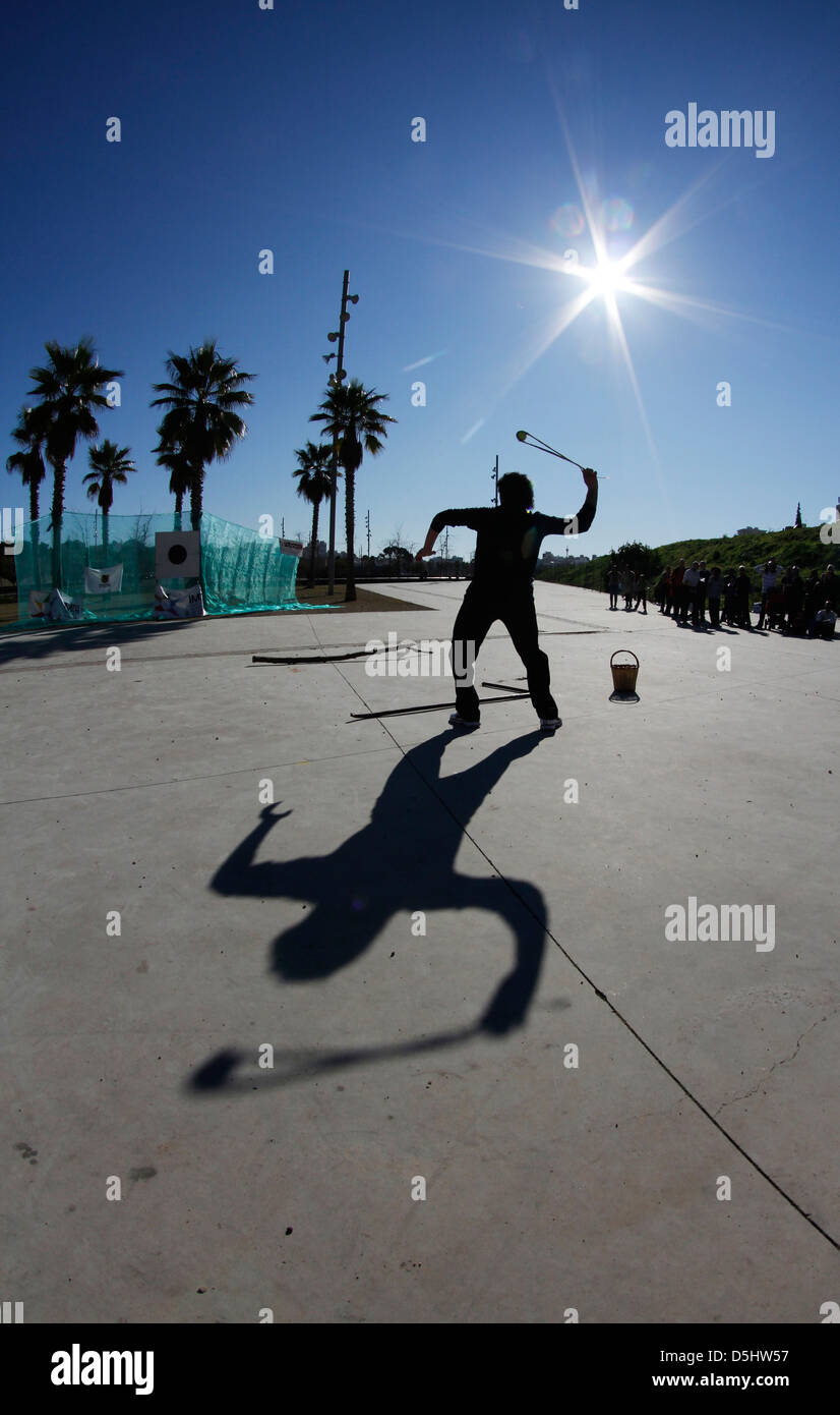 A slinger throws a stone during a sling demonstration in the Spanish ...