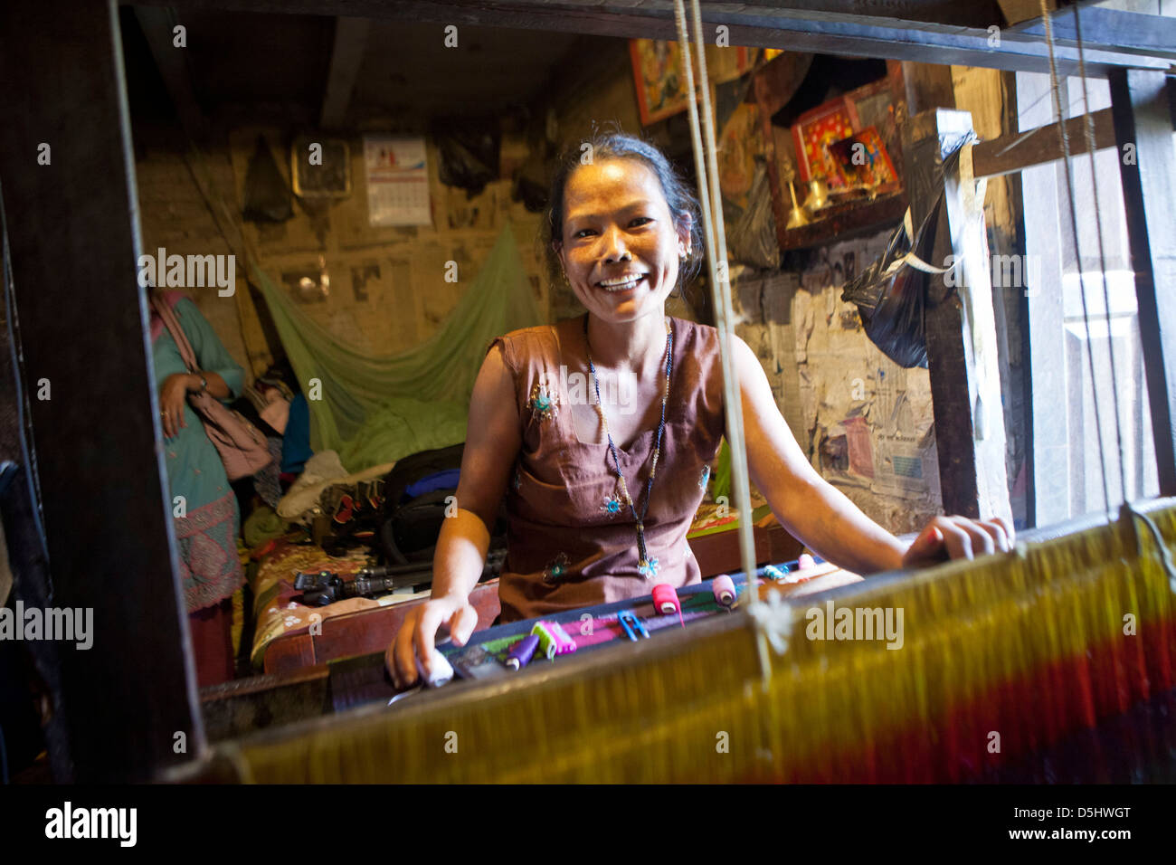 Traditional Nepalese material being crafted by a woman producing ...