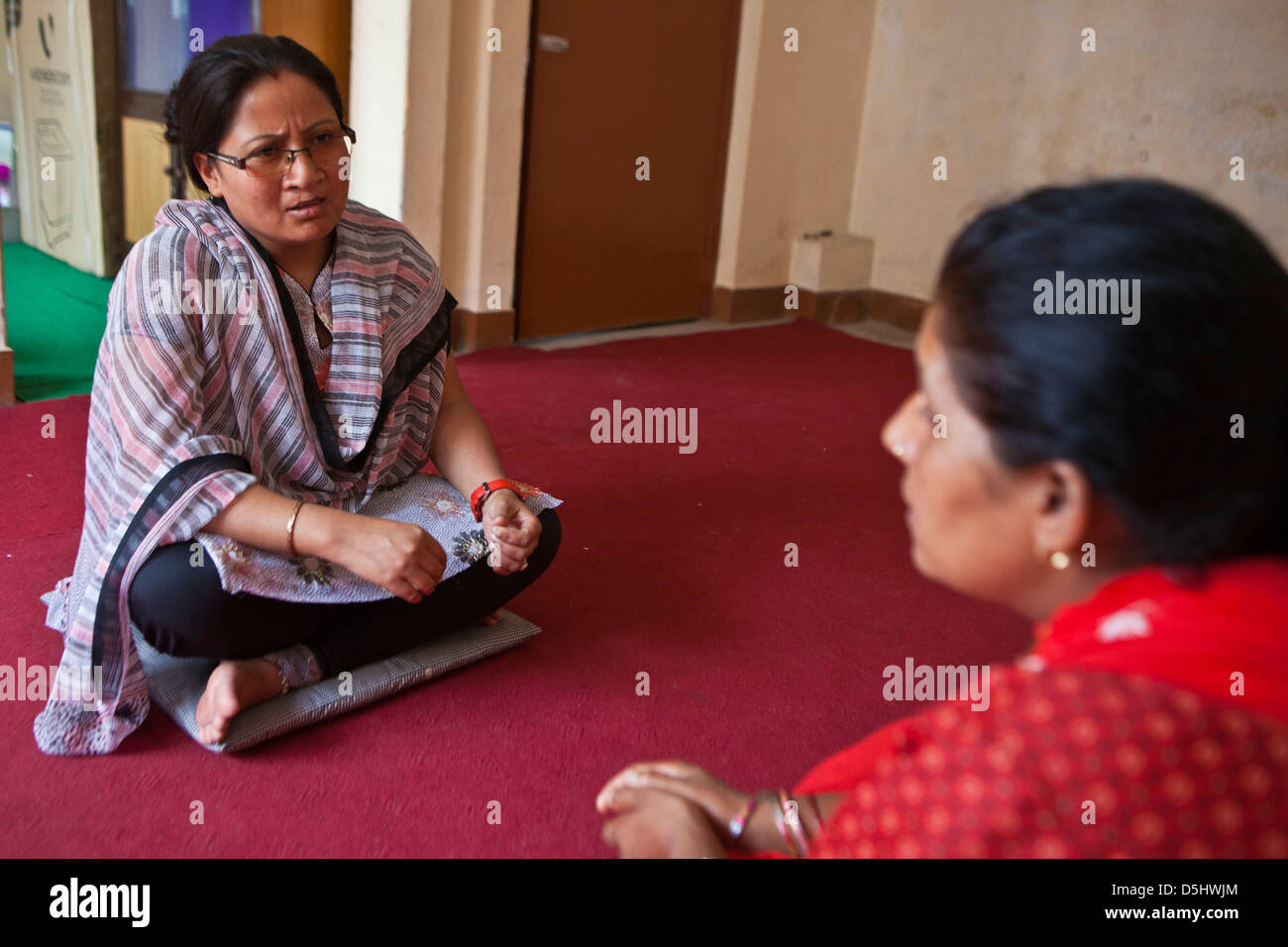 Nepalese woman talks to a social worker. Voice of Children centre in ...